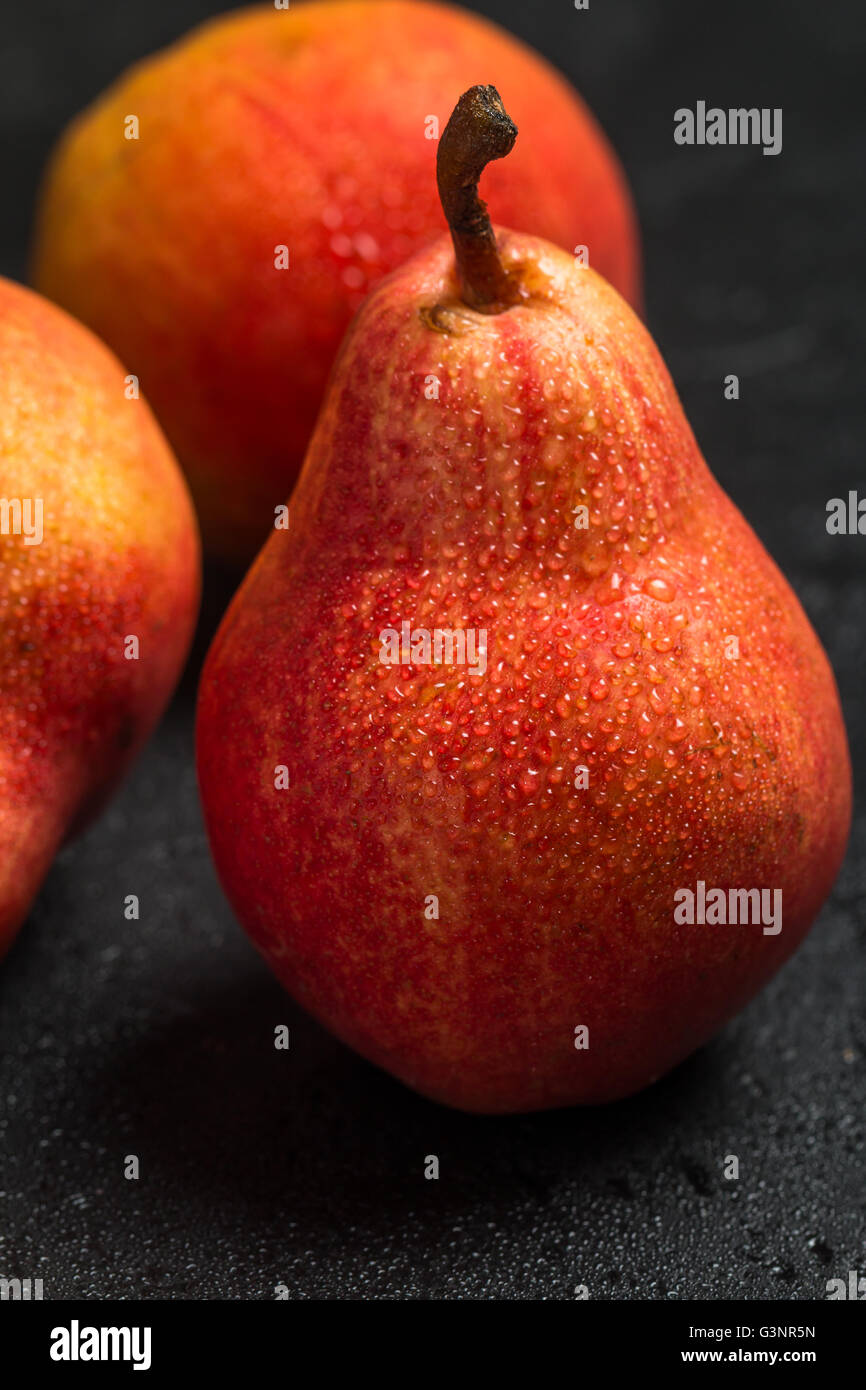Wet red pears Stock Photo - Alamy