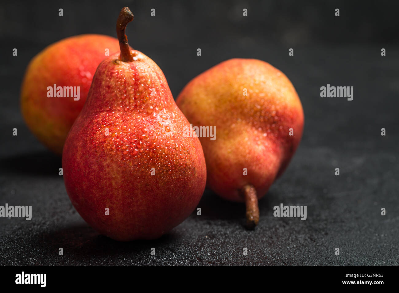 Wet red pears Stock Photo - Alamy
