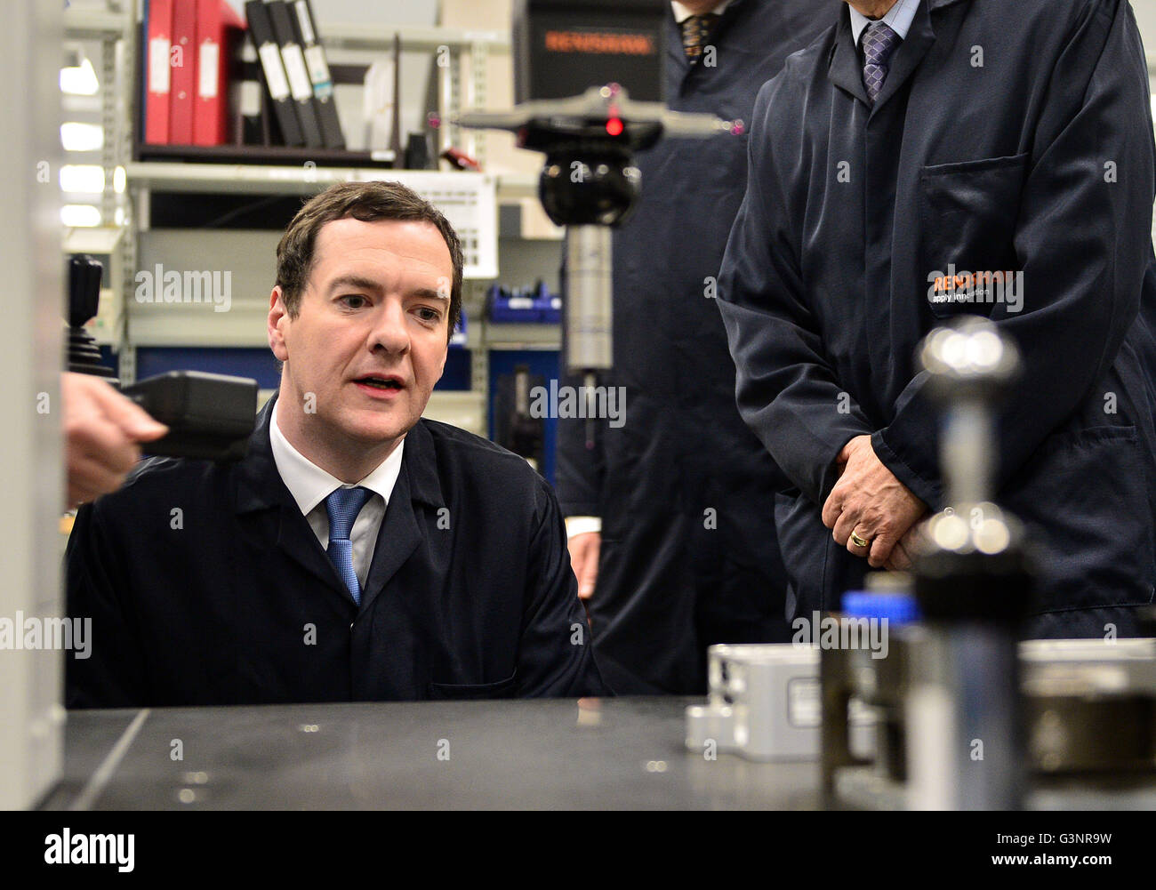 Chancellor George Osborne watches a measuring device being operated ...
