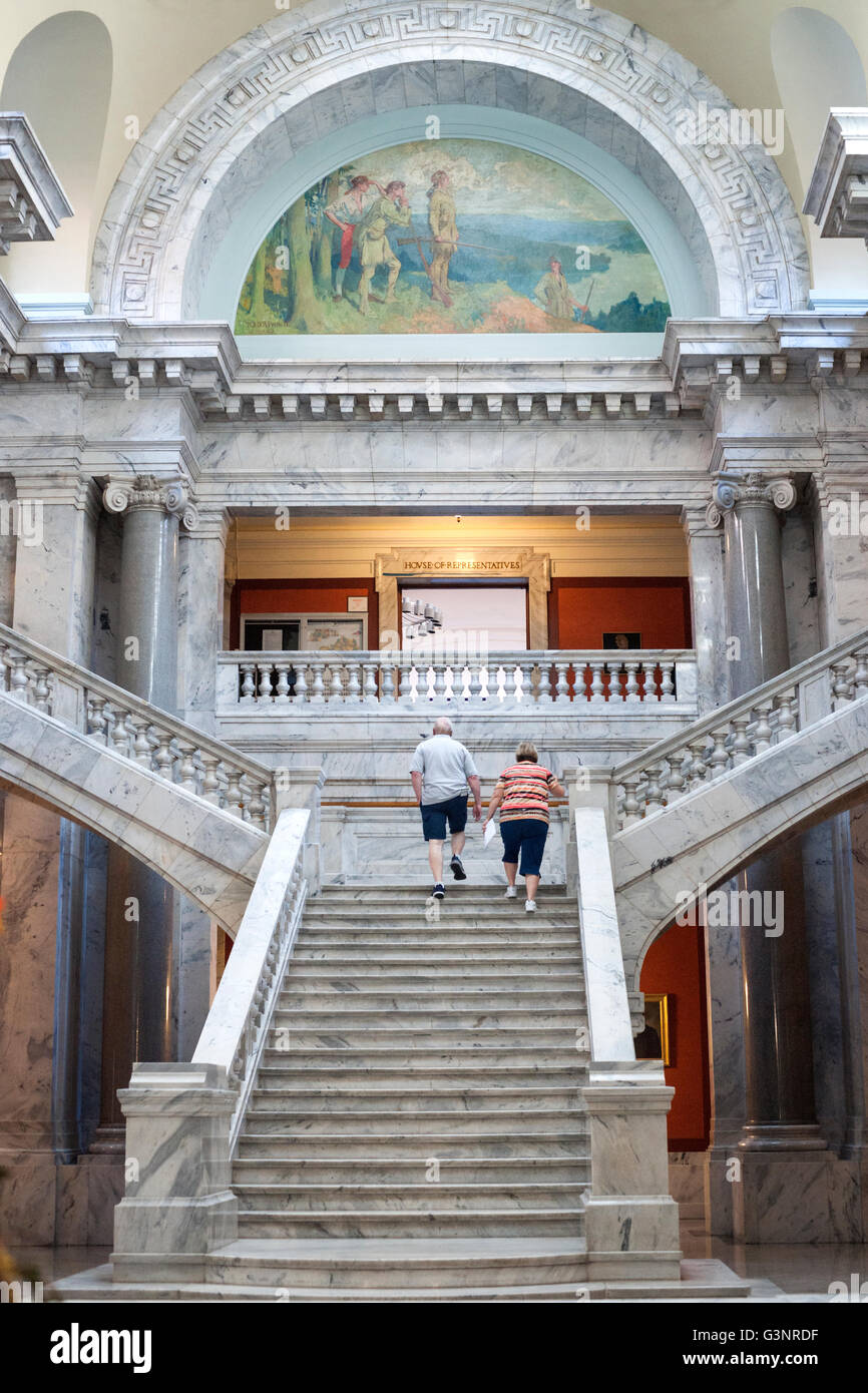 Senior couple ascend marble staircase inside the Kentucky State Capitol ...