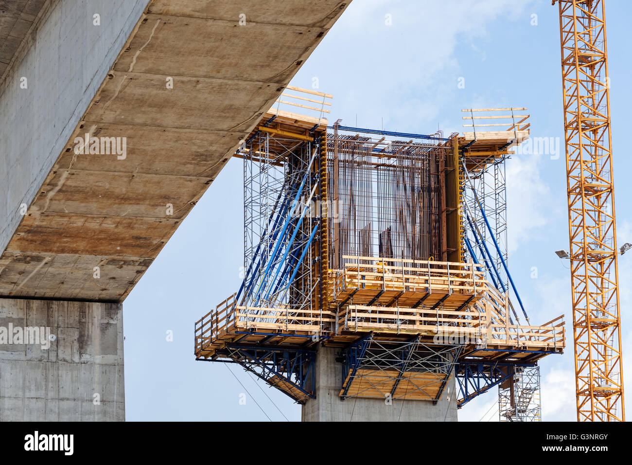high altitude concrete bridge construction with crane and framework ...