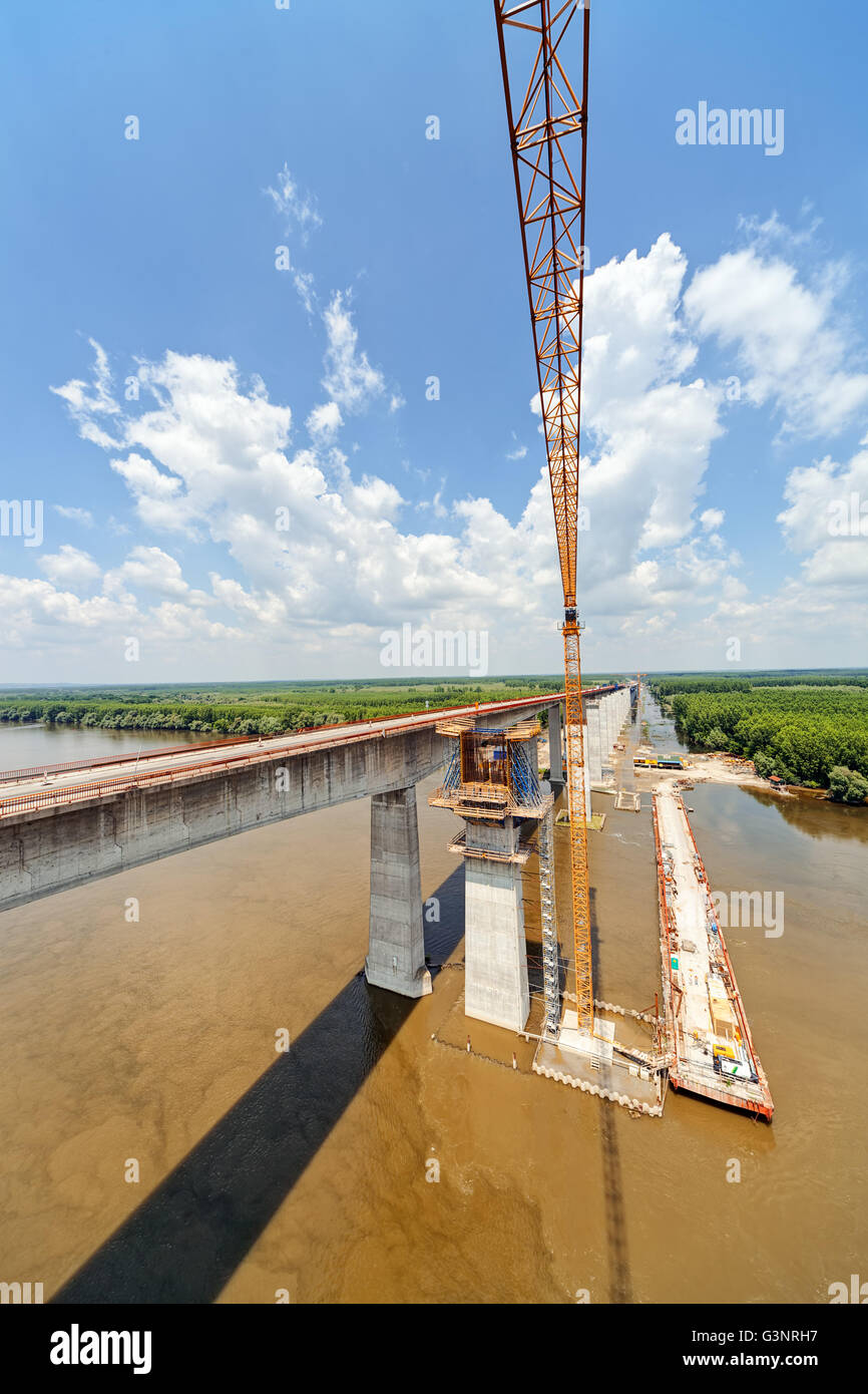 high altitude concrete bridge construction with crane and framework ...