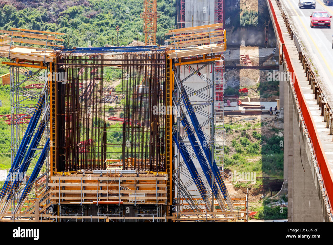 high altitude concrete bridge construction with crane and framework ...