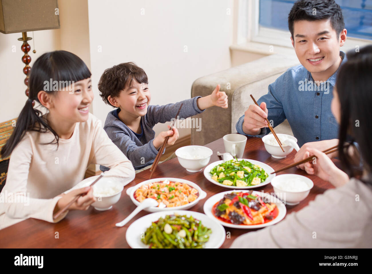 Indian family eating rice hi-res stock photography and images - Alamy