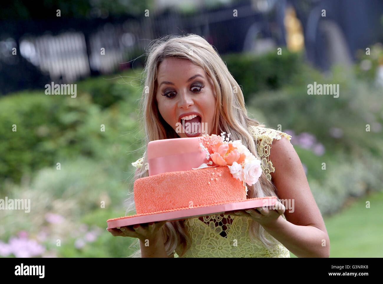 Coral brand ambassador Carly Baker models a hat made out of cake ...