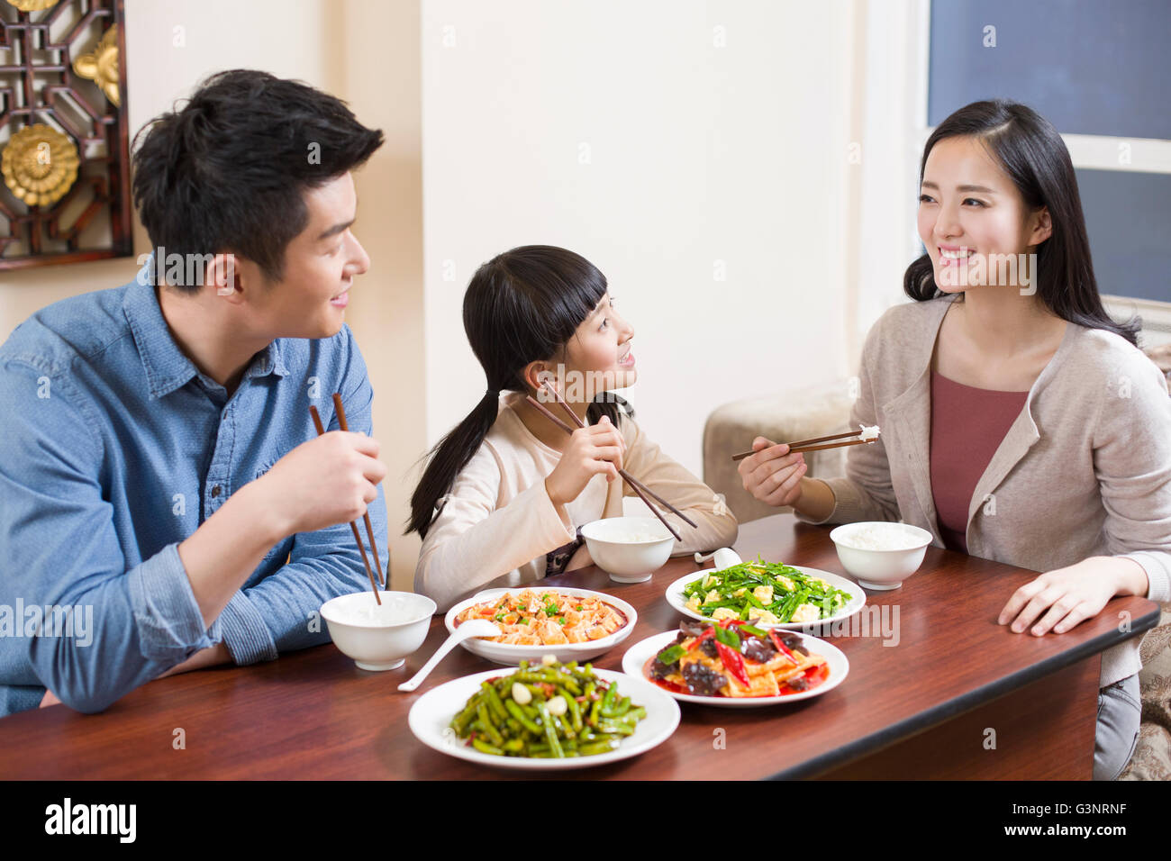 Indian family eating rice hi-res stock photography and images - Alamy