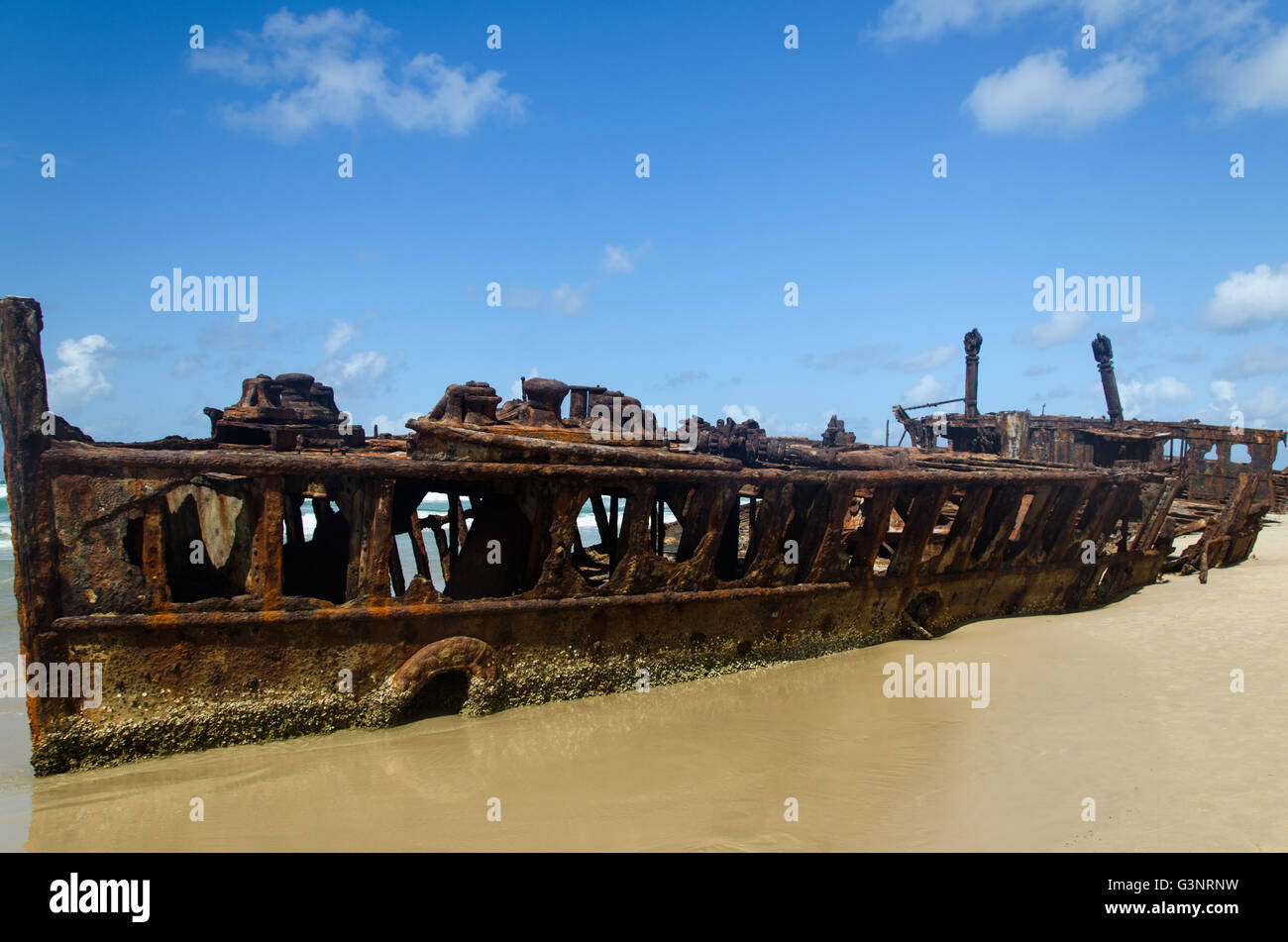 Impressive SS Maheno luxury shipwreck resting on the beach on clear ...