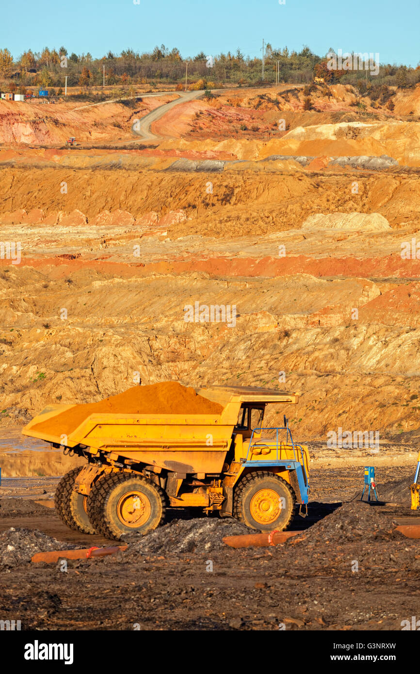 open mining pit with heavy machinery Stock Photo - Alamy
