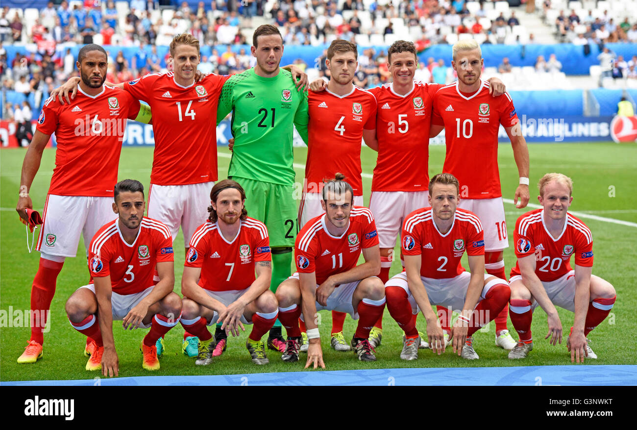 The Welsh team line up for a group photo ahead of their game with ...
