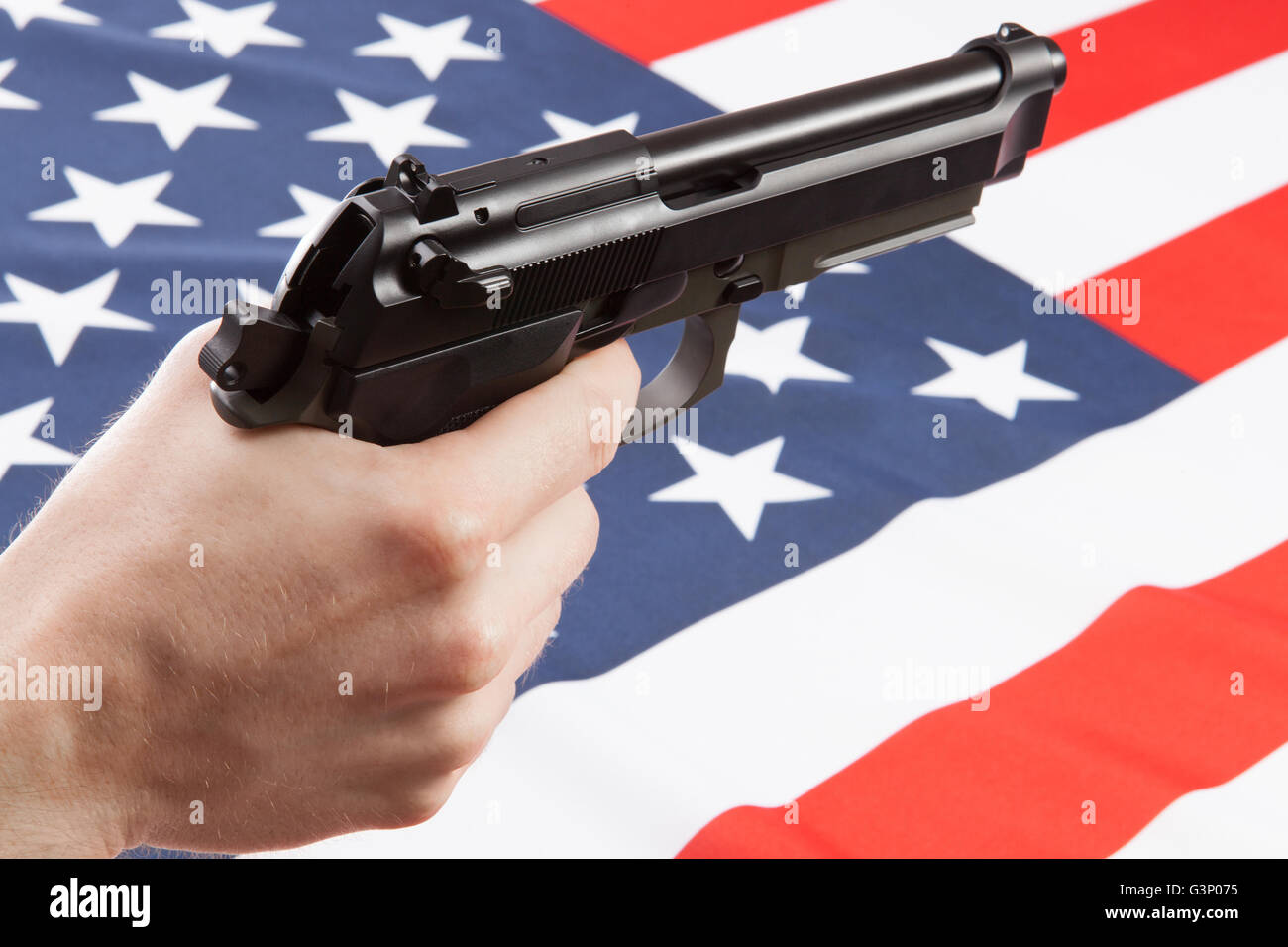 Hand gun us flag hi-res stock photography and images - Alamy