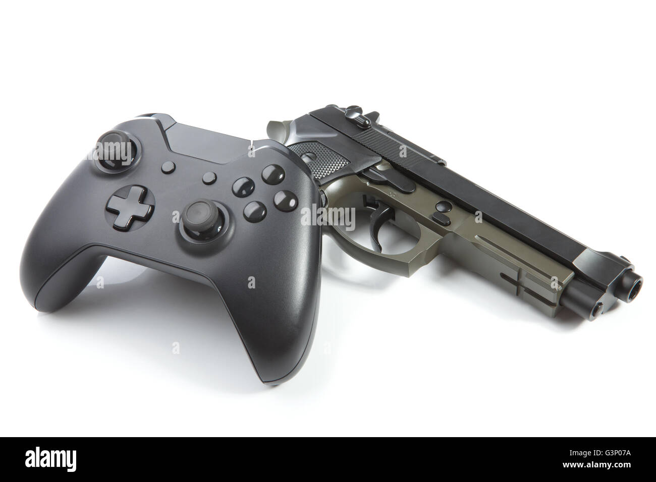 Game controller with real handgun near it - virtual and real life ...