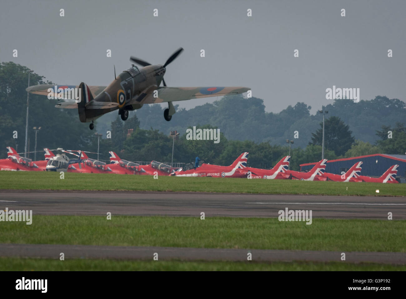RAF Spitfire plane taking off at Biggin Hill airport with RAF Red Arrow ...
