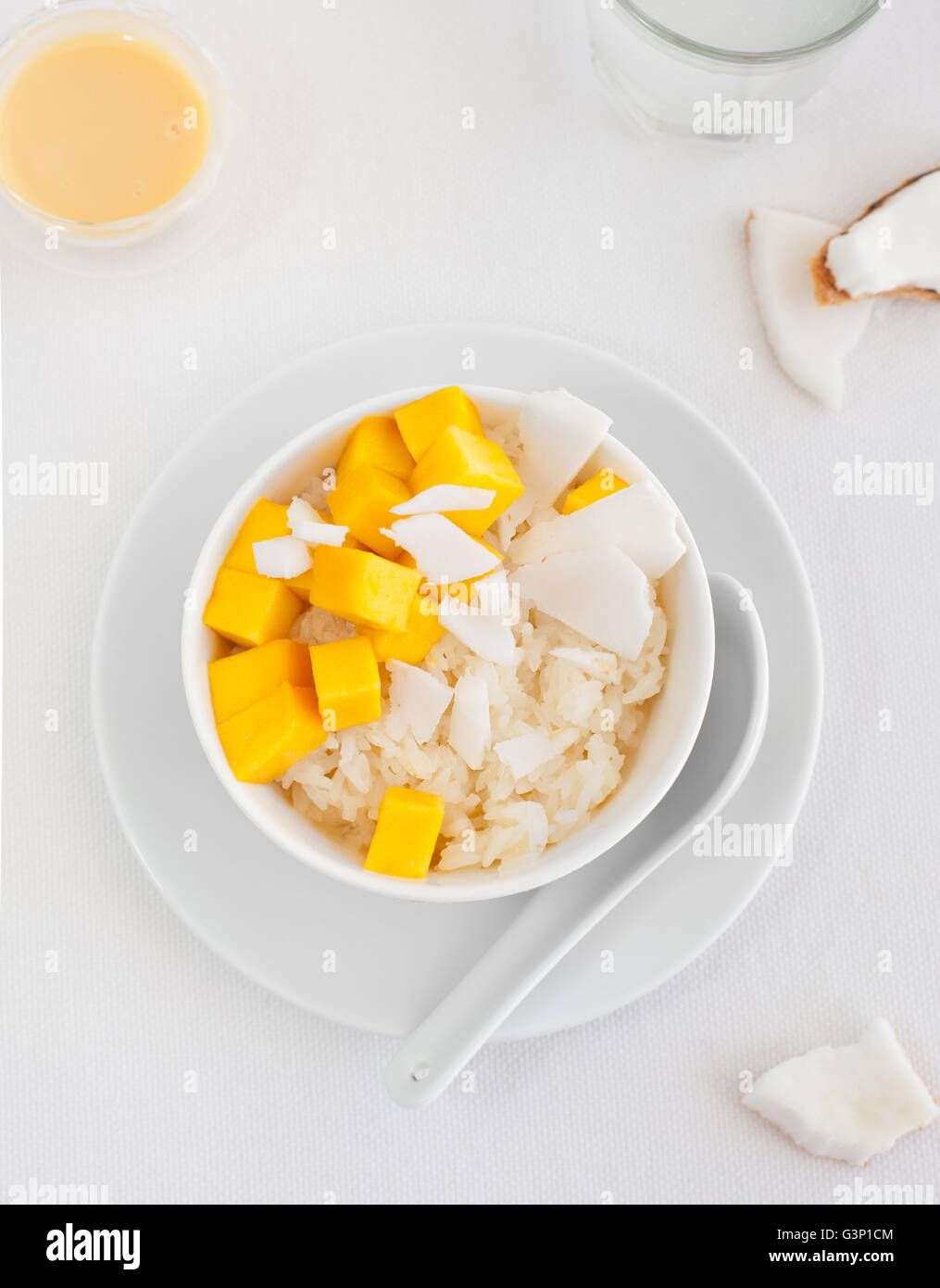 Rice pudding with mango and coconut water in bowl Stock Photo - Alamy