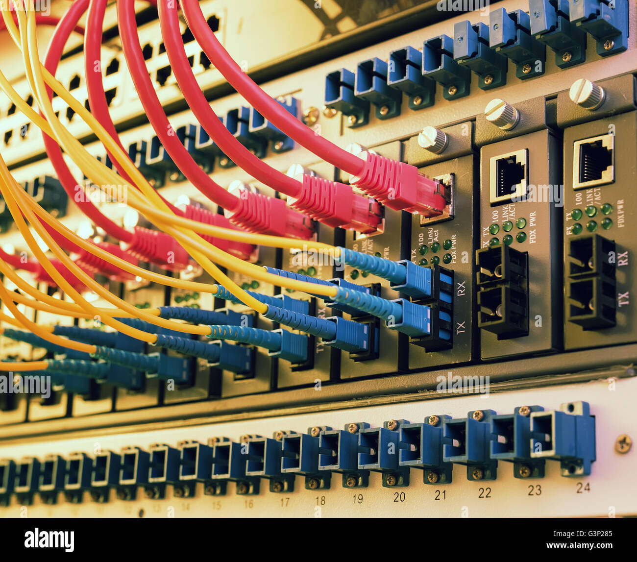 Fiber network switch with some yellow optical network cables Stock ...