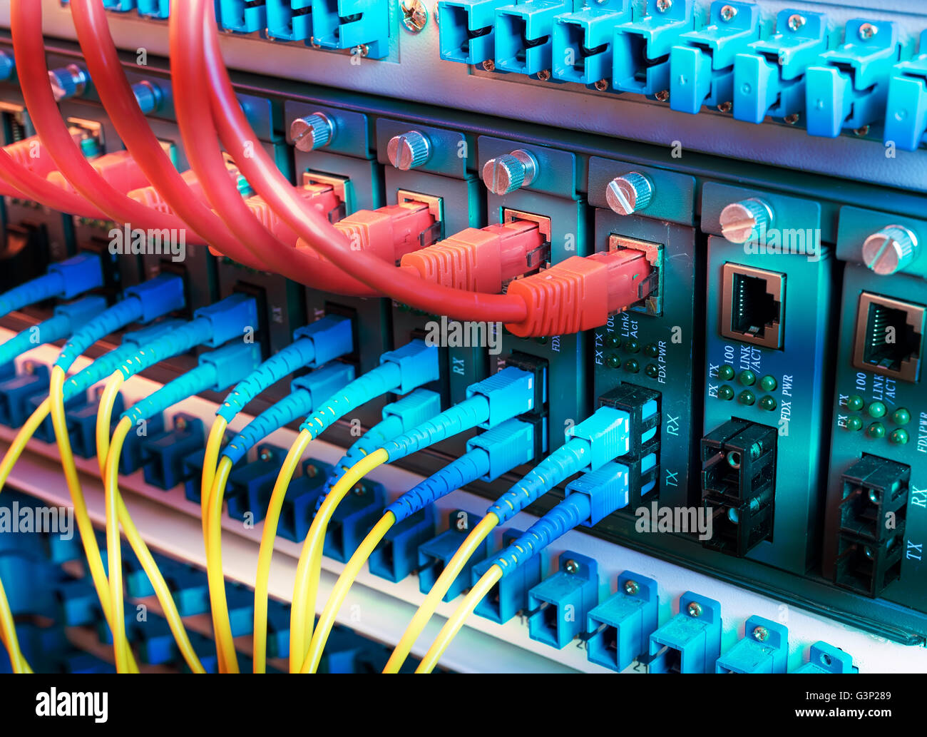 Fiber network switch with some yellow optical network cables Stock ...