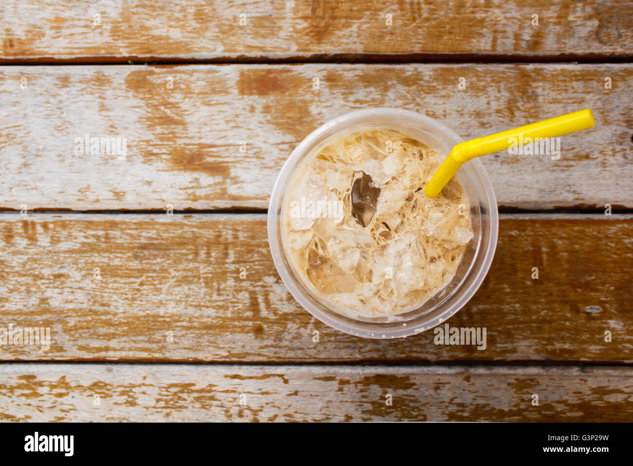 Iced coffee on wood background Stock Photo - Alamy