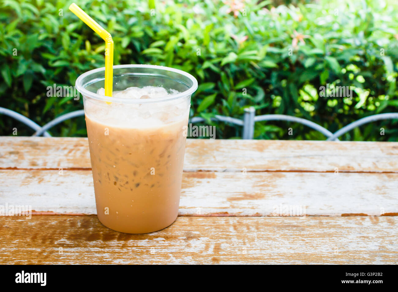 Iced coffee on wood background Stock Photo - Alamy