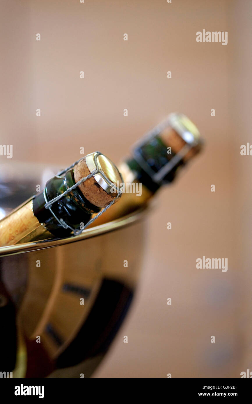 Focus on champagne caps in a metal bucket Stock Photo - Alamy