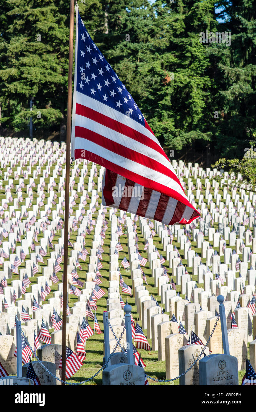 The American Flag waves over the grave markers of American war hero's ...