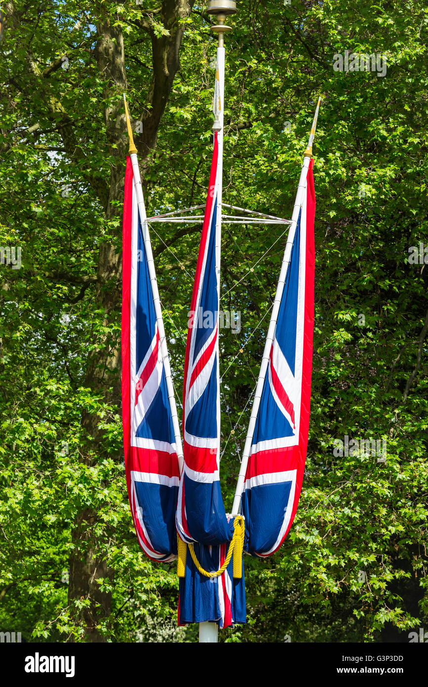British flags with green trees as background Stock Photo - Alamy
