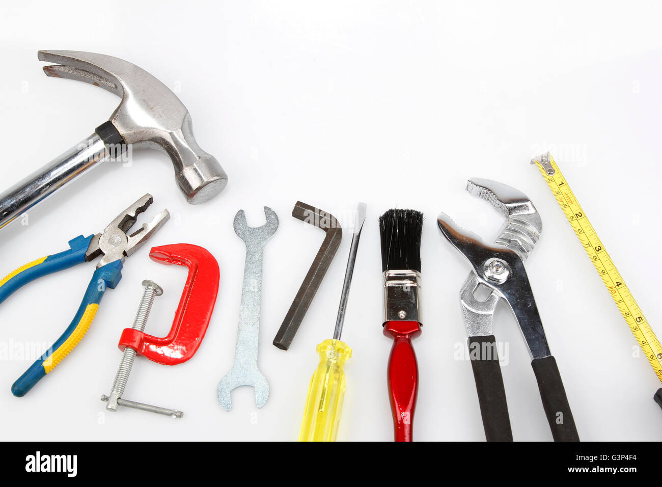 Assortment of tools on plain background Stock Photo - Alamy