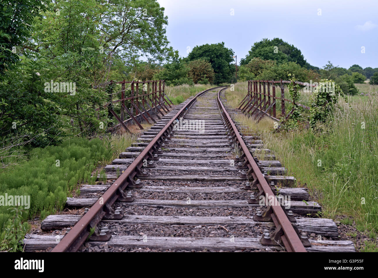 A disused train track runs through the North Norfolk countryside in ...