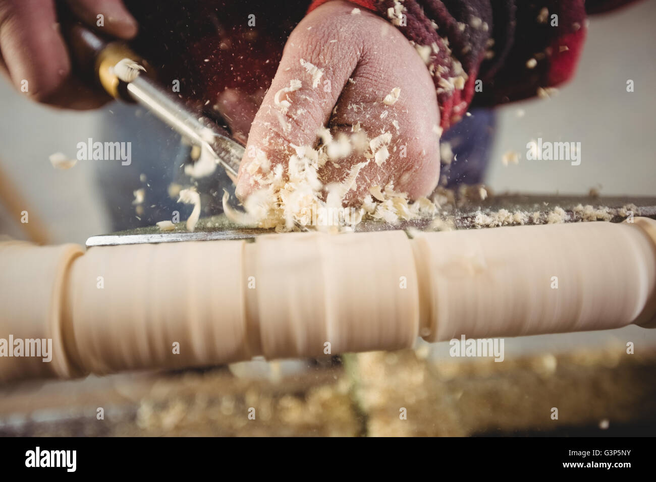 Carpenter sculpting a wood piece Stock Photo - Alamy