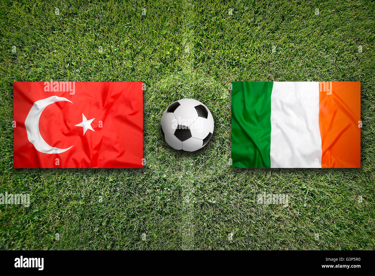 Turkey vs. Ireland flags on green soccer field Stock Photo - Alamy