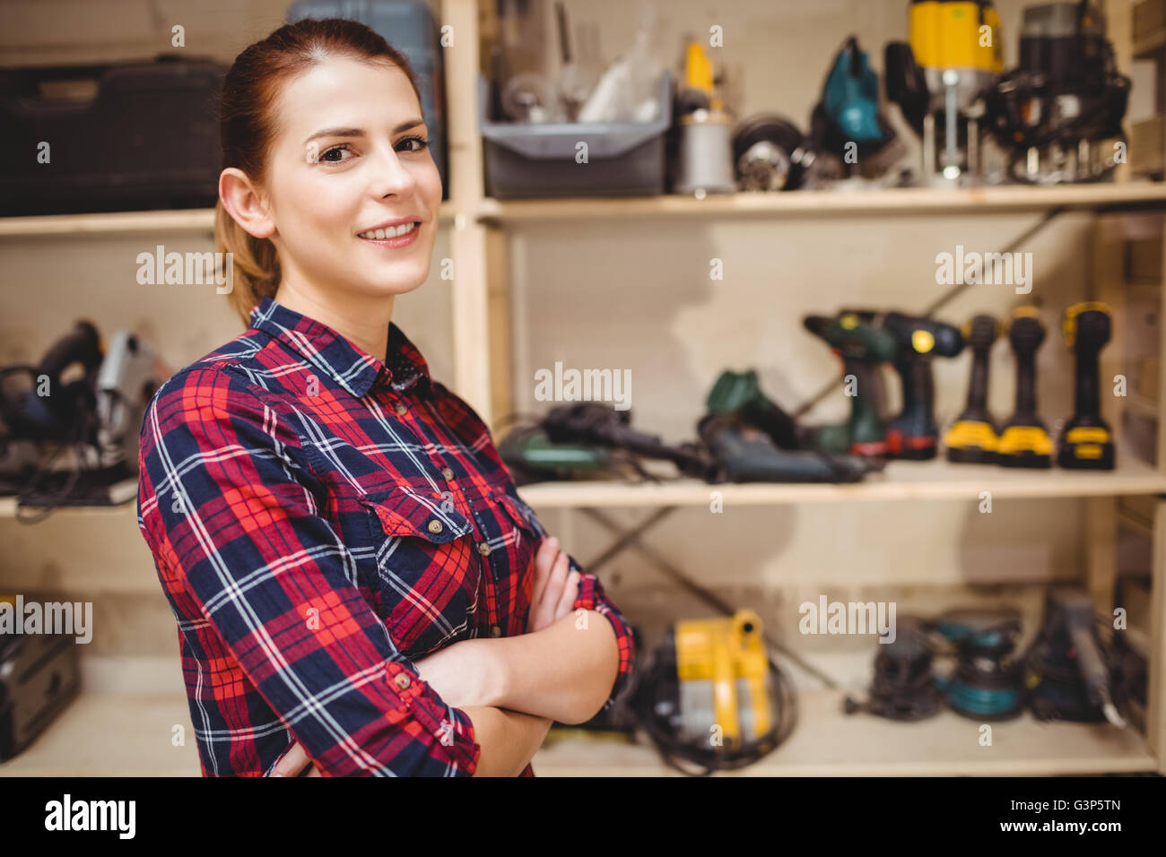 Portrait of a carpenter arms crossed Stock Photo - Alamy