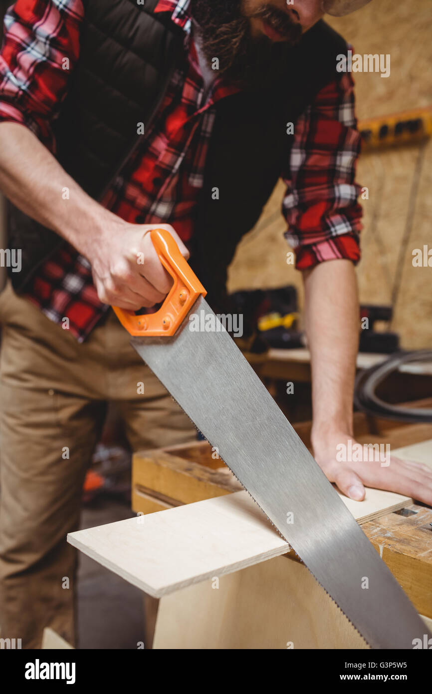 Worker sawing wood hi-res stock photography and images - Alamy