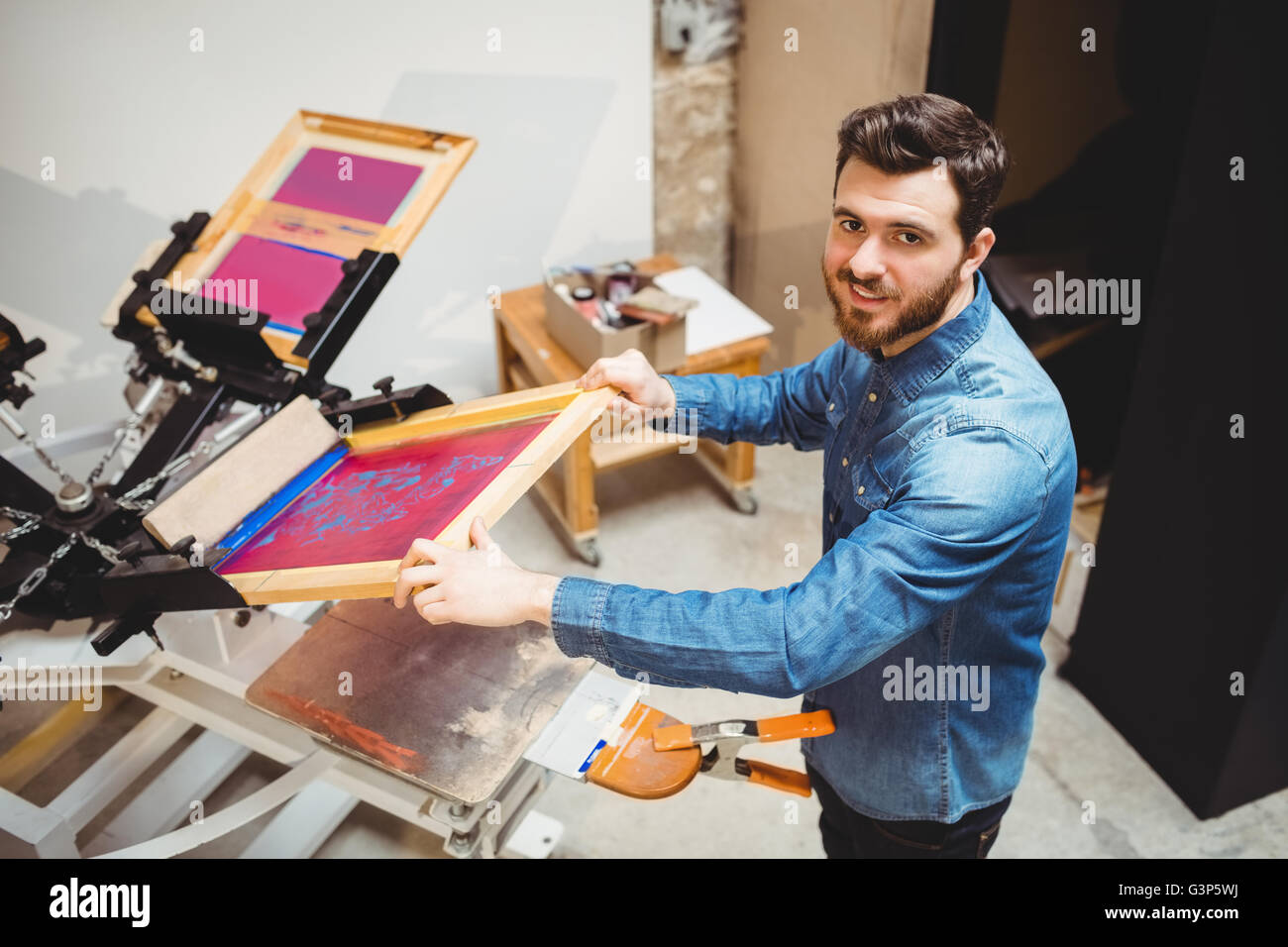 Craftsman painting on wood Stock Photo - Alamy