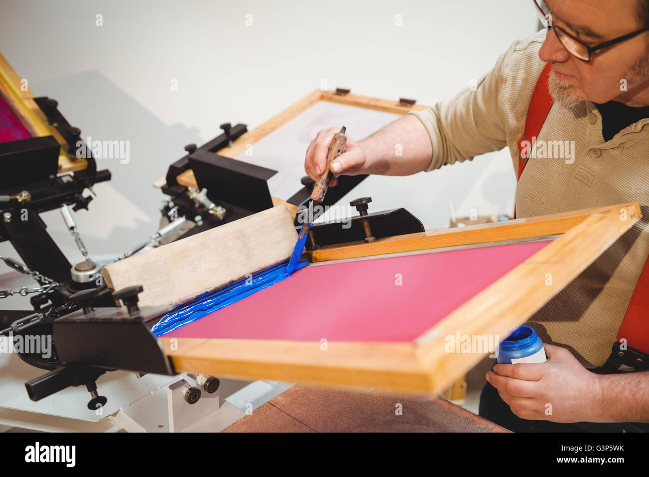 Craftsman painting on wood Stock Photo - Alamy