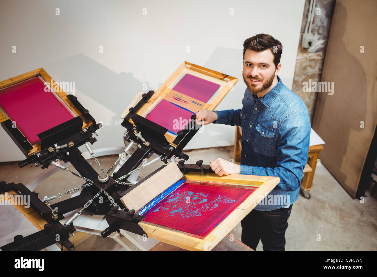 Craftsman painting on wood Stock Photo - Alamy