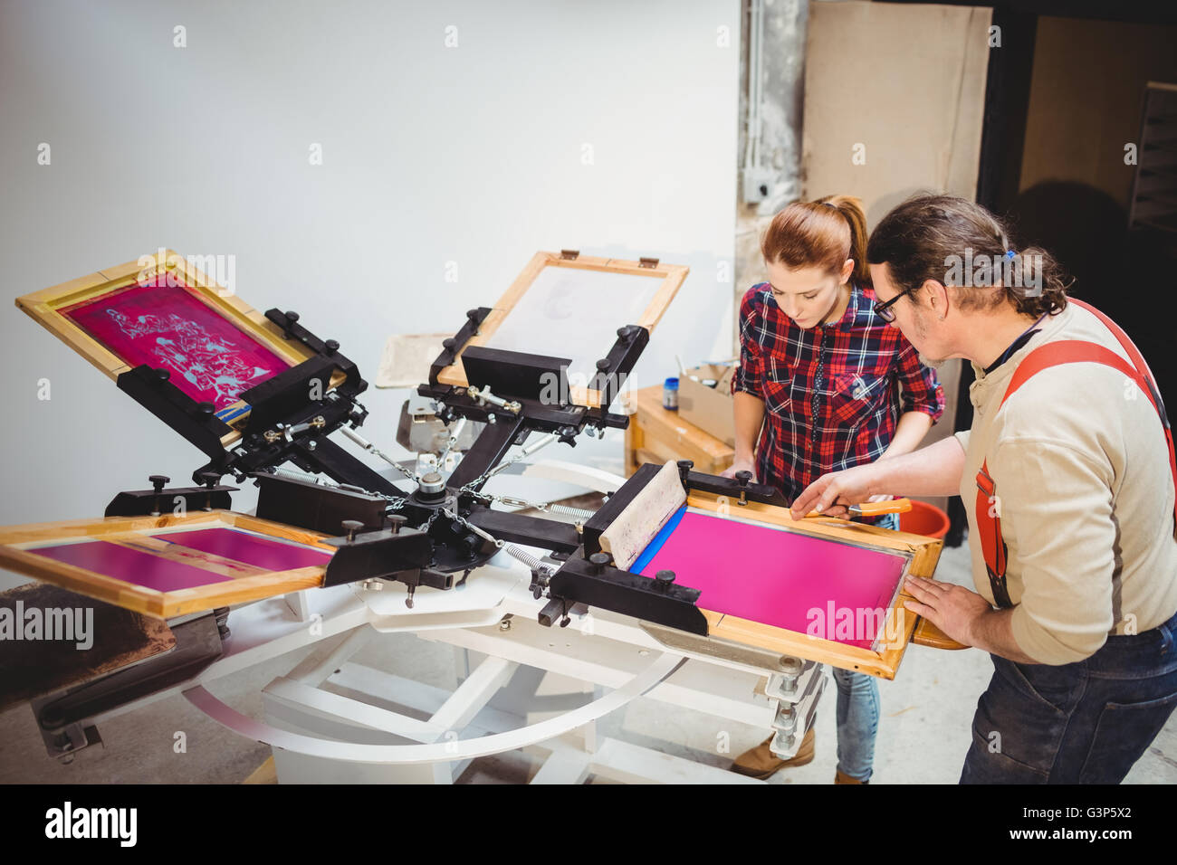 Craftsman painting on wood Stock Photo - Alamy