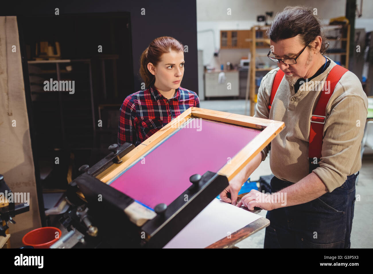 Craftsman painting on wood Stock Photo - Alamy