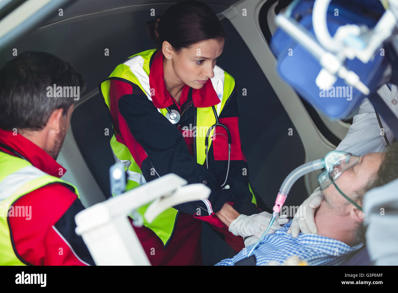 Ambulance crew and doctor taking care of an injured person Stock Photo ...