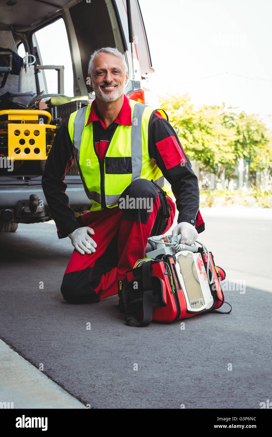 Portrait of a smiling ambulance man Stock Photo - Alamy