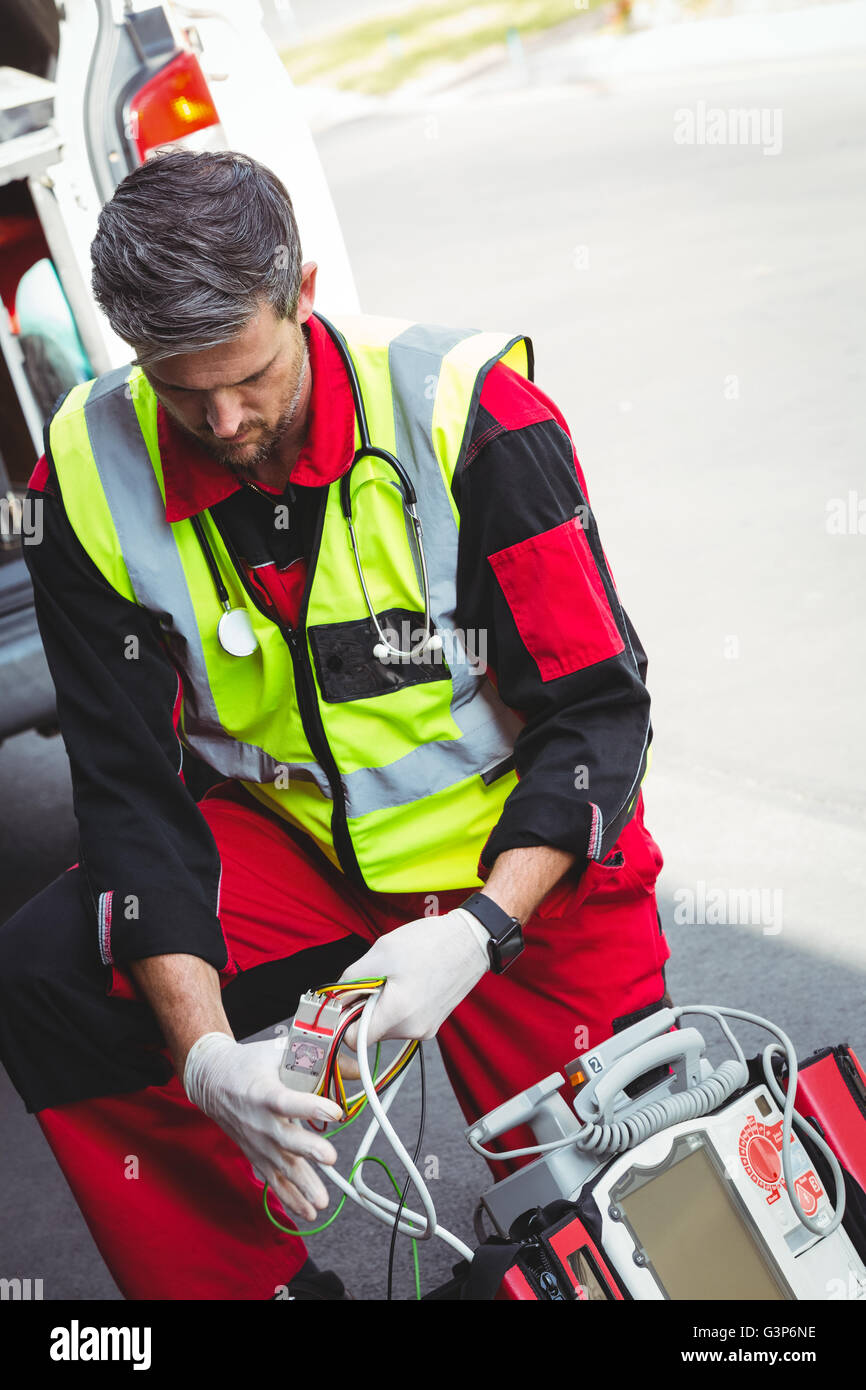 Ambulance man preparing ambulance equipment Stock Photo - Alamy