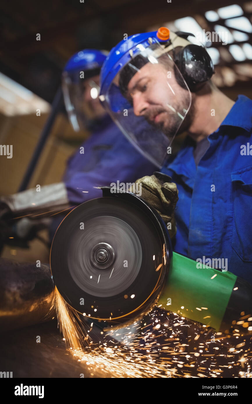 Professional workers cutting metal saw hi-res stock photography and ...