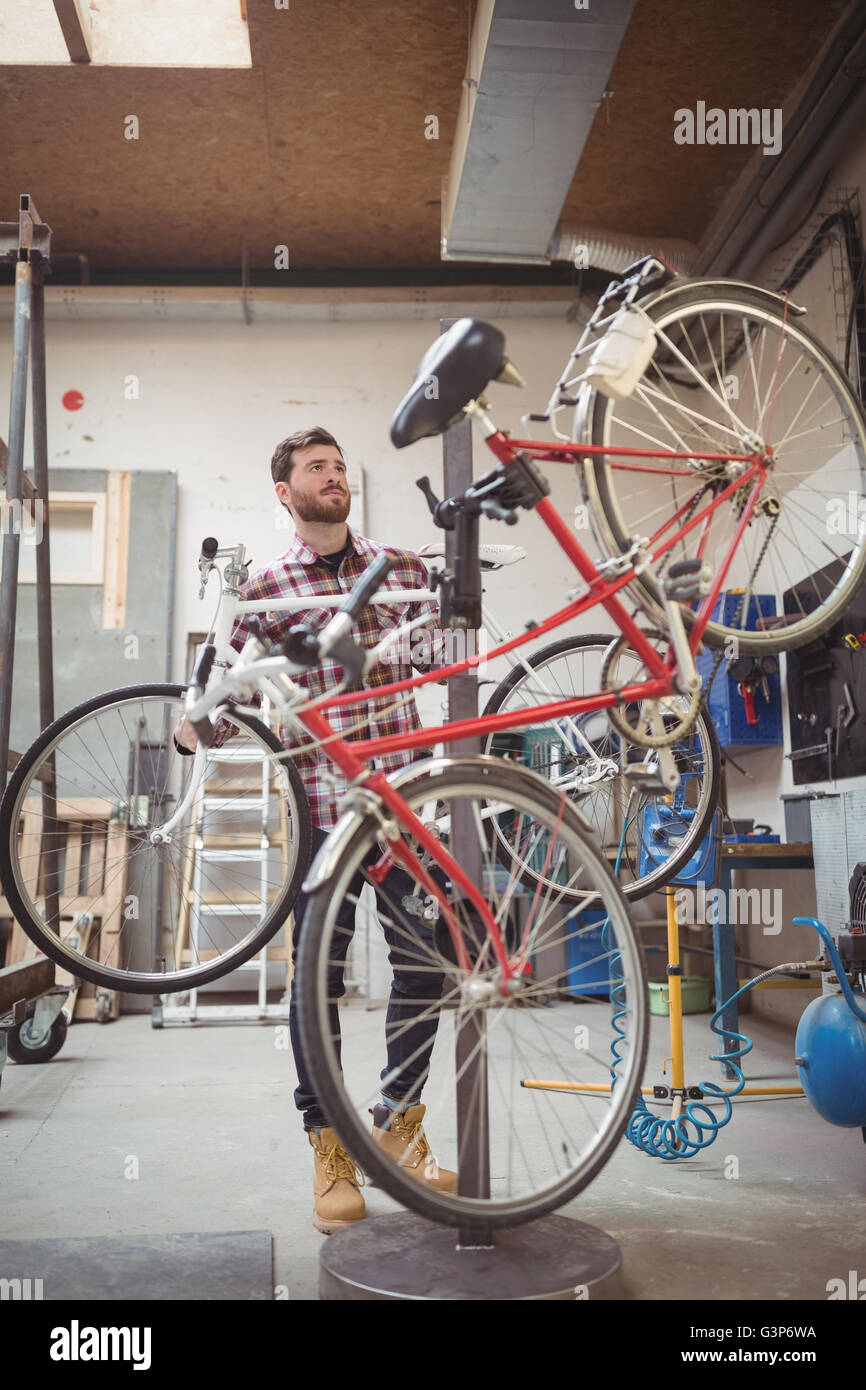 Mechanic repairing a bicycle Stock Photo - Alamy