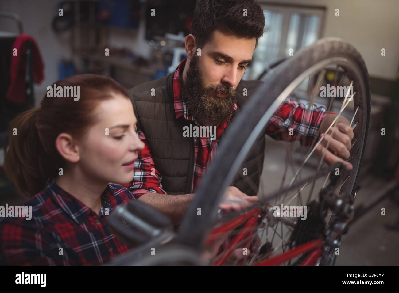Mechanics fixing a bike hi-res stock photography and images - Alamy