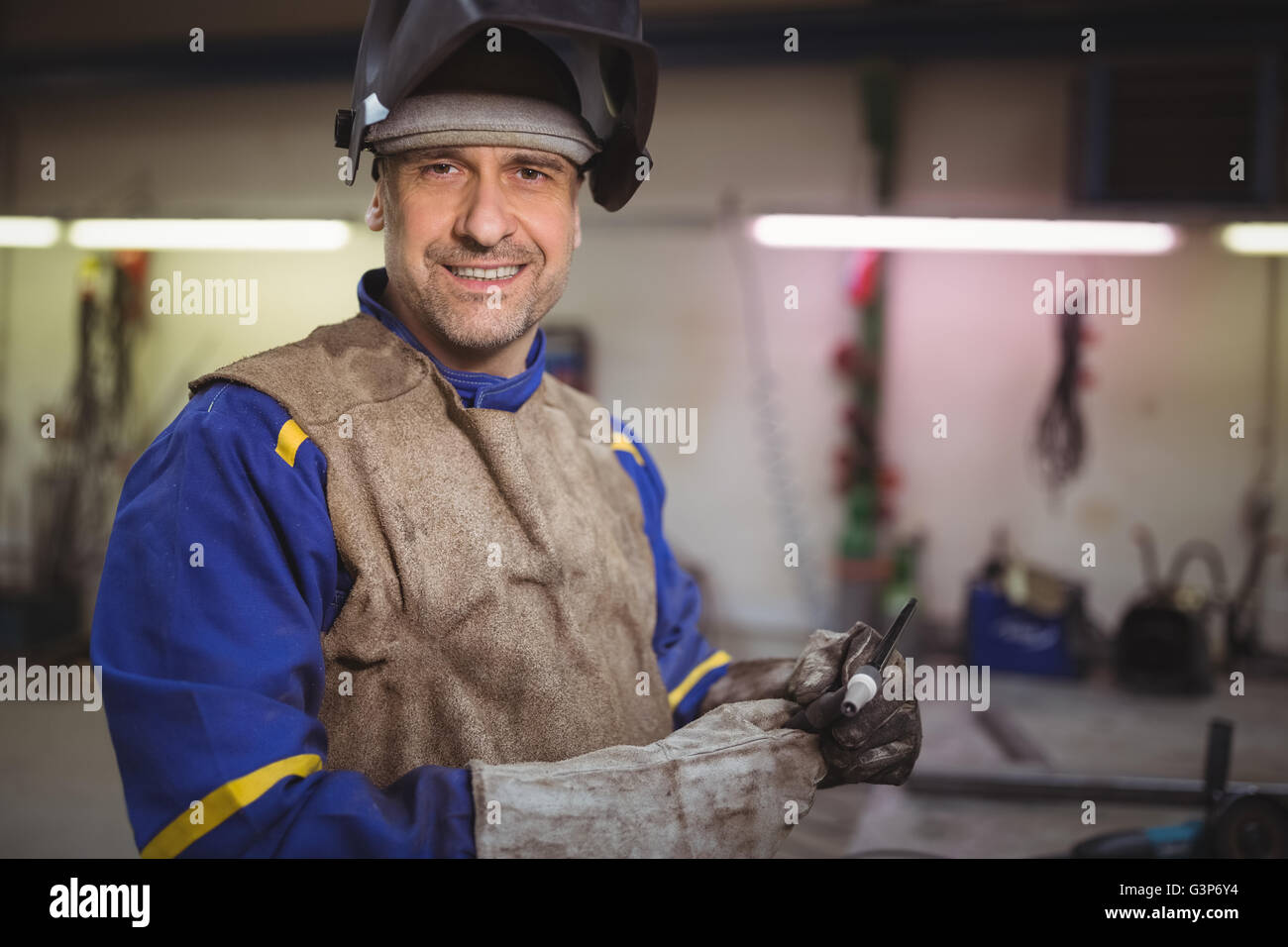 Portrait of welder smiling and posing Stock Photo - Alamy