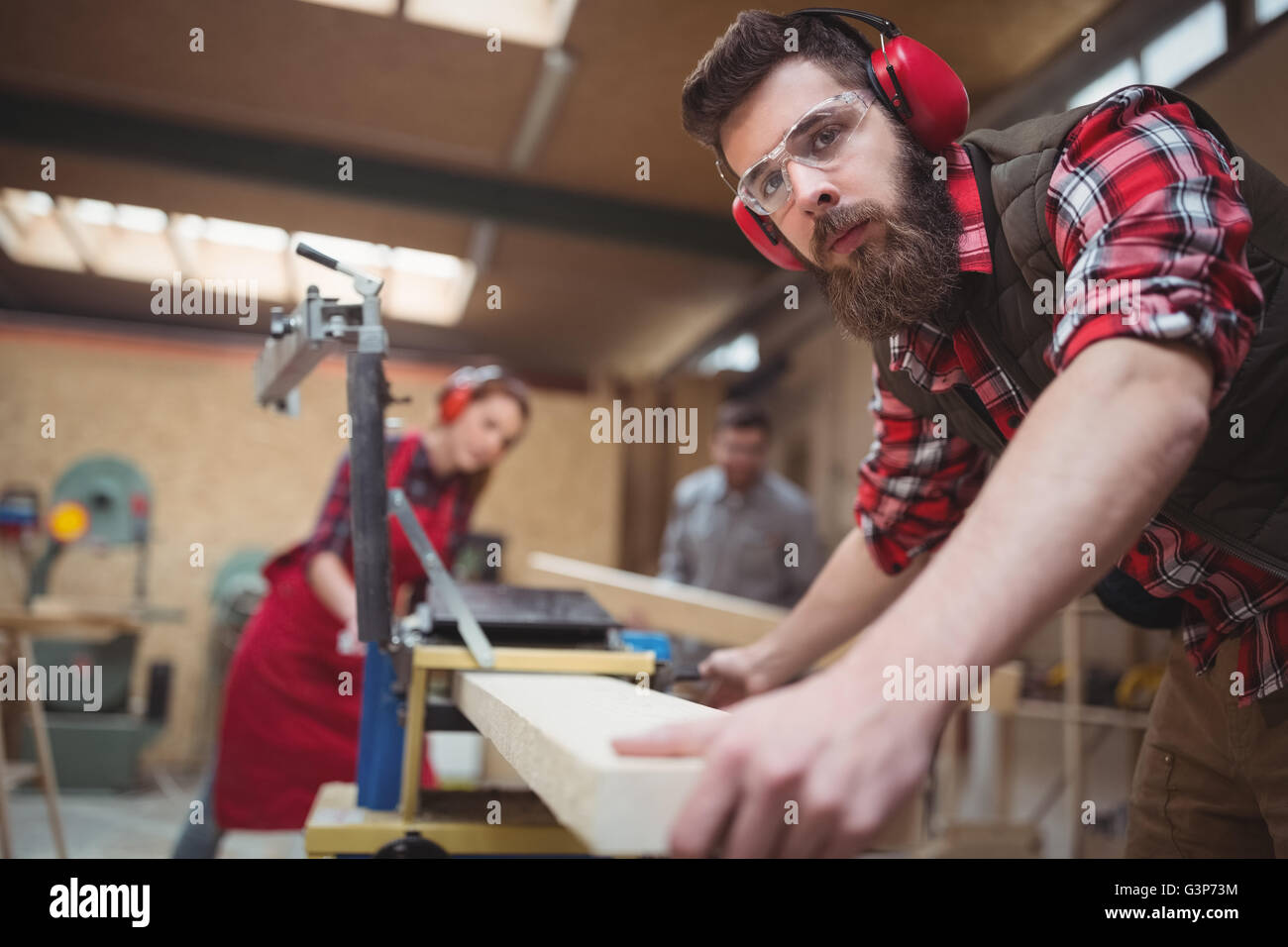 Young carpenter holding wooden hi-res stock photography and images - Alamy