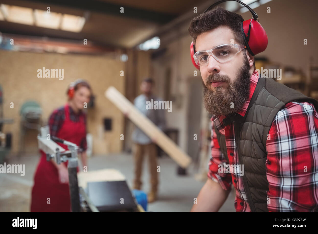 Portrait of carpenter working Stock Photo - Alamy