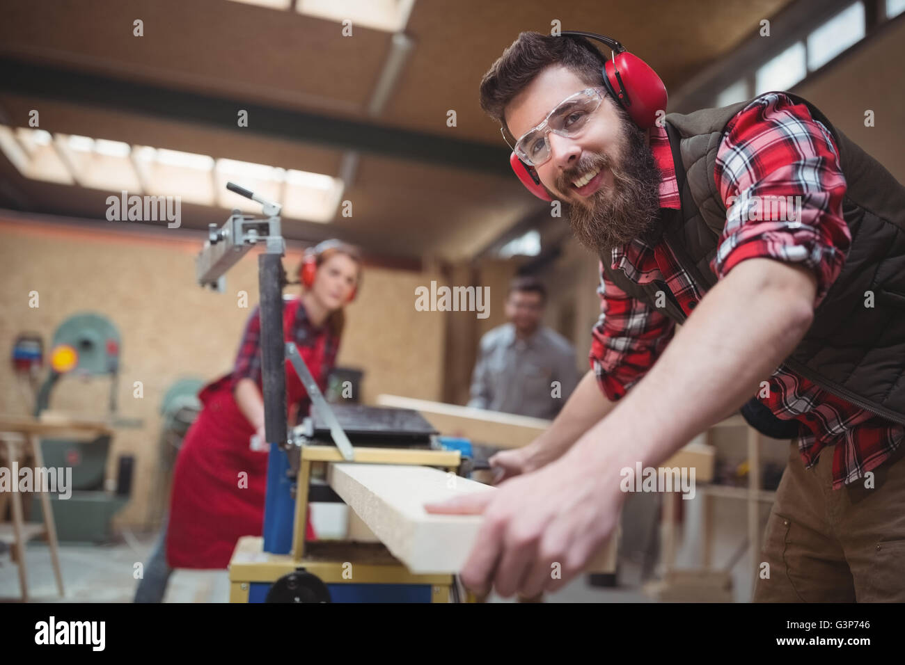 Young carpenter holding wooden hi-res stock photography and images - Alamy