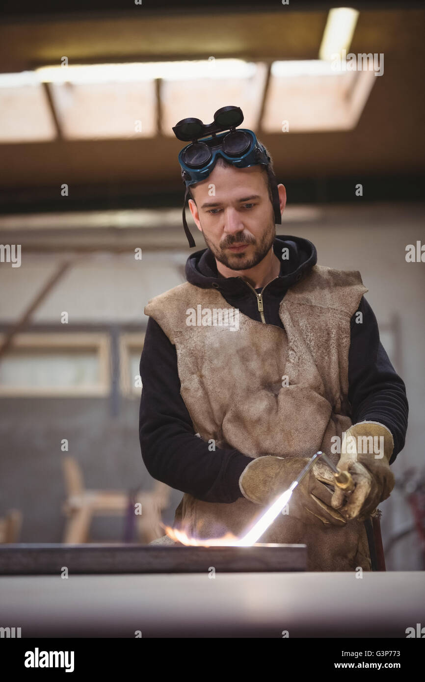 Welder using a welding torch Stock Photo - Alamy