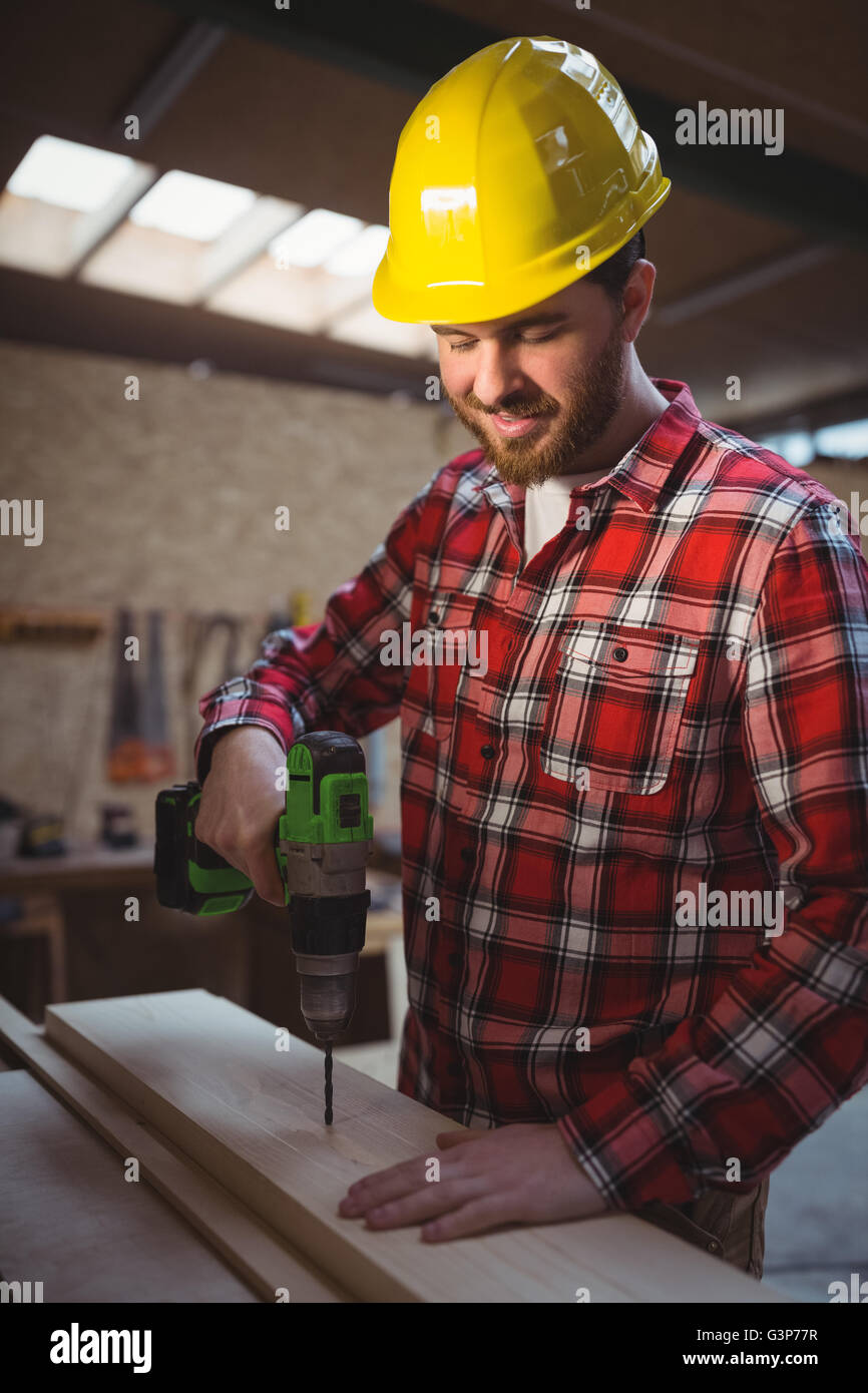 Carpenter using drill machine Stock Photo - Alamy