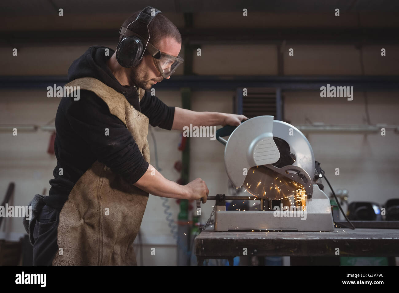 Welder working with machine Stock Photo - Alamy