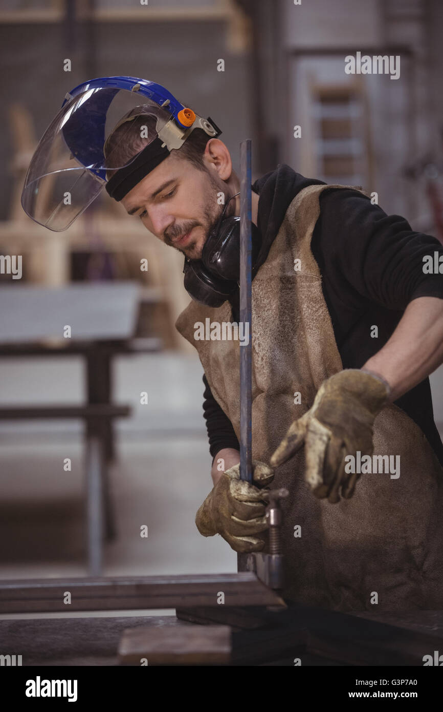Welder working with machine Stock Photo - Alamy