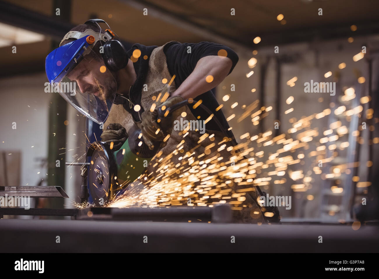 Welder working with machine Stock Photo - Alamy